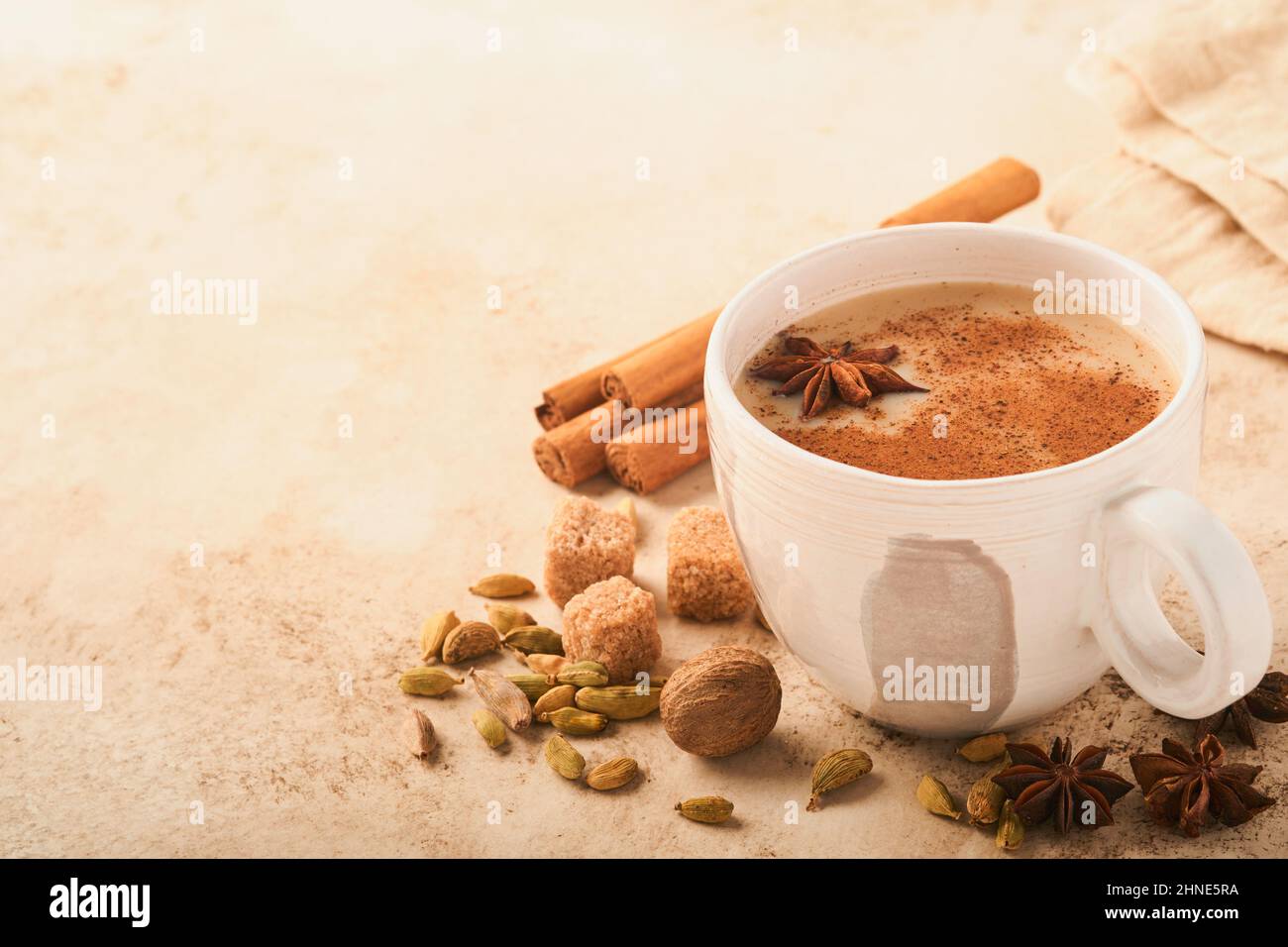 Masala tea. Masala chai spiced tea with milk and spices on light warm ...