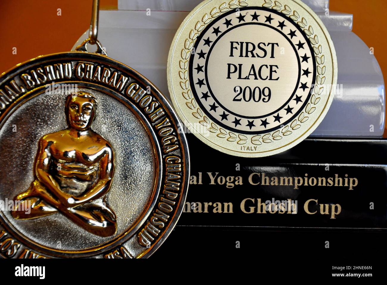 A trophy and medals for the winner of the International Yoga ...