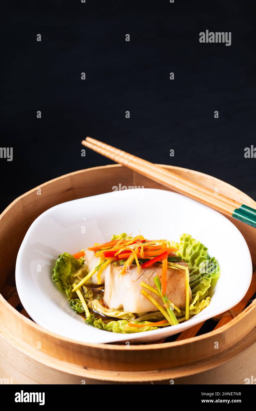 Asian food concept Chinese Steamed fish with ginger and soy sauce in ...
