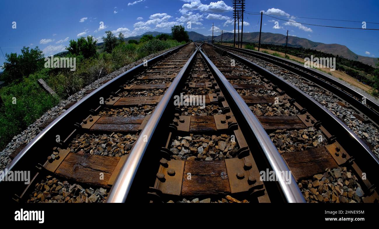 Railroad tracks leading into the horizon iron rails for transportation Stock Photo - Alamy