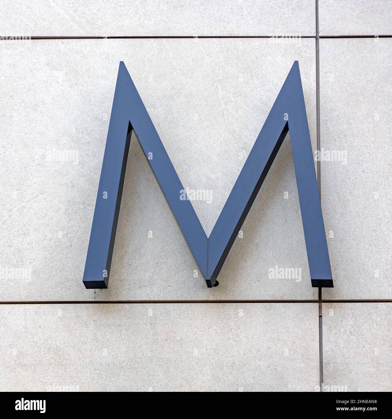 Big Metal Letter M at Building Wall Stock Photo - Alamy