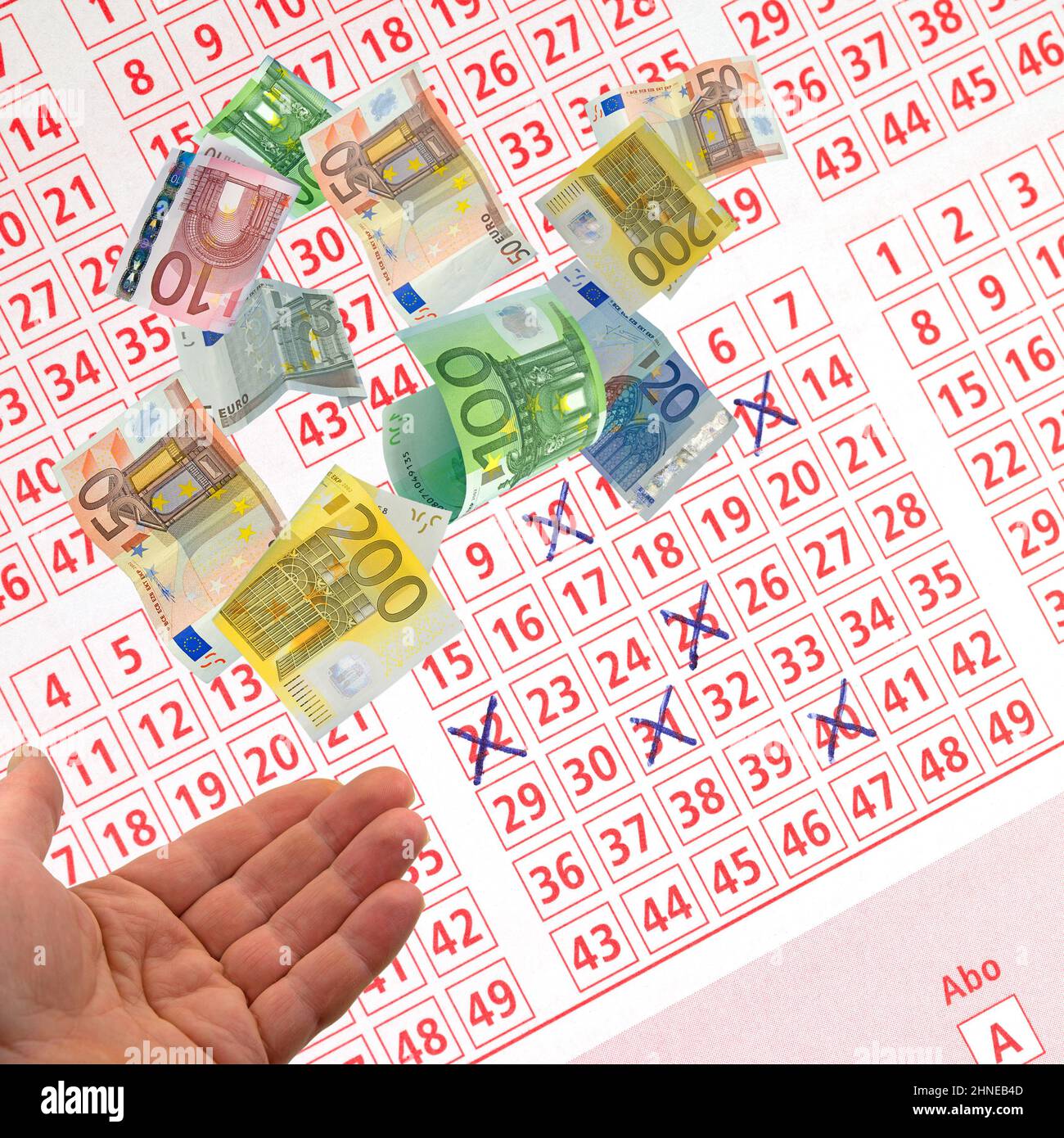 Opened hand in front of lottery ticket and banknotes Stock Photo - Alamy