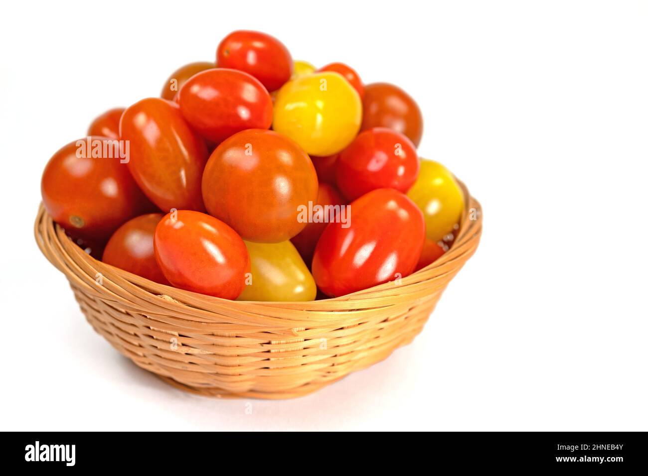 Various mini tomatoes against a white background Stock Photo - Alamy