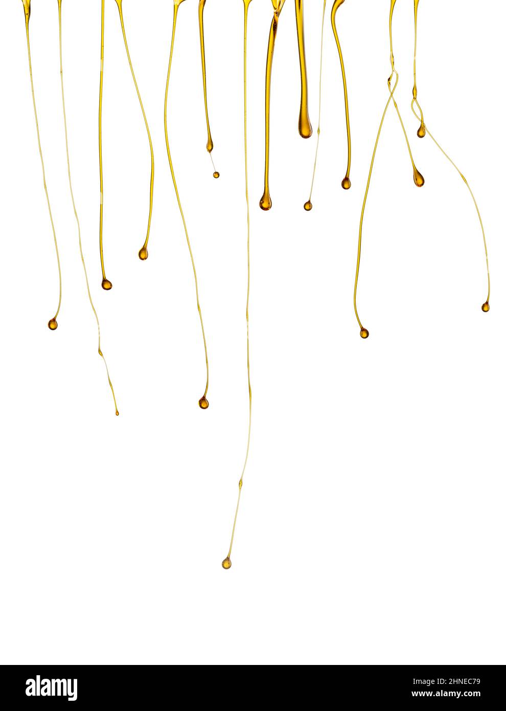 Olive or engine oil dripping on white background Stock Photo - Alamy