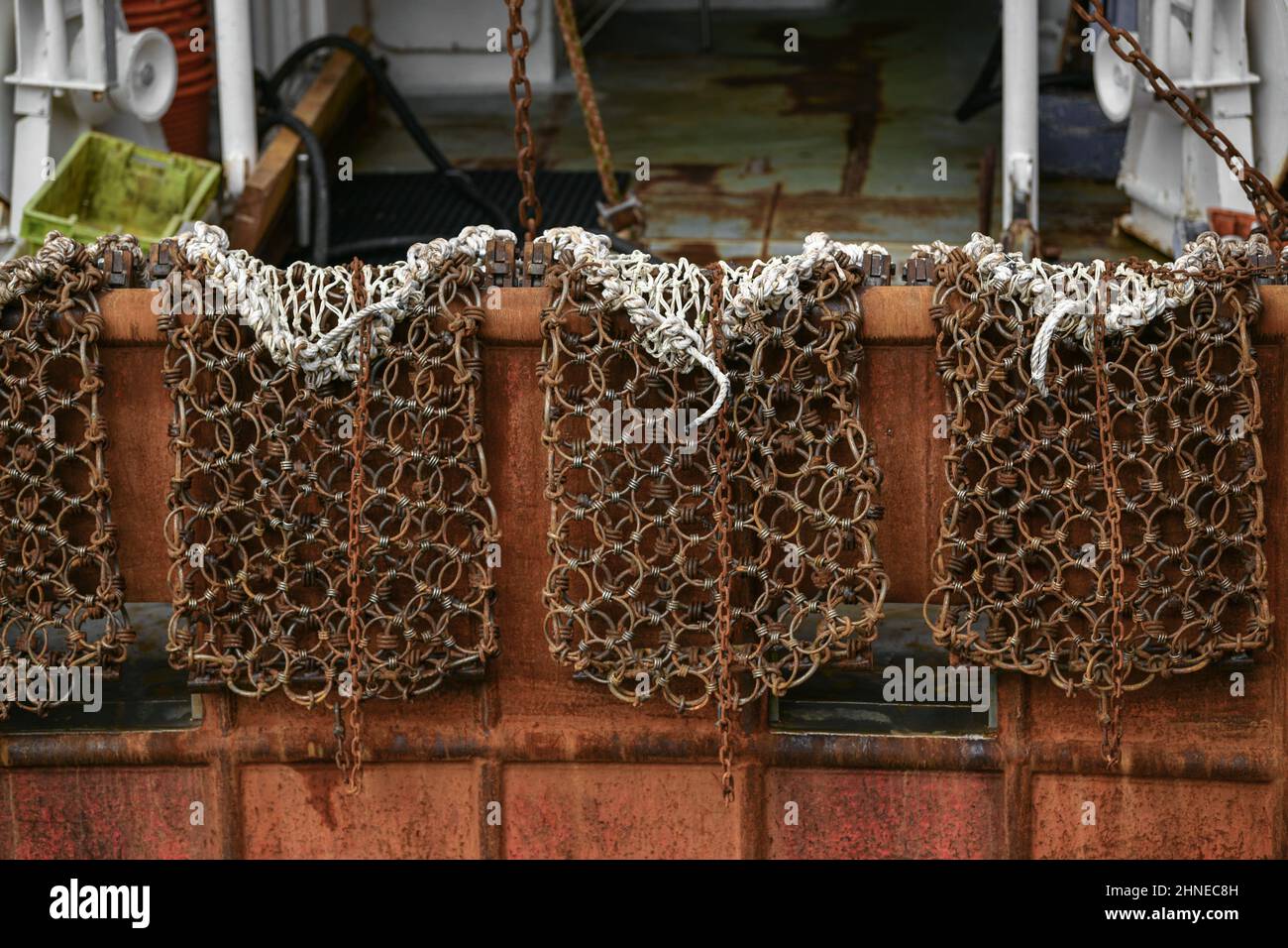 Red rusty boats and metal nets for catching scallops Stock Photo - Alamy