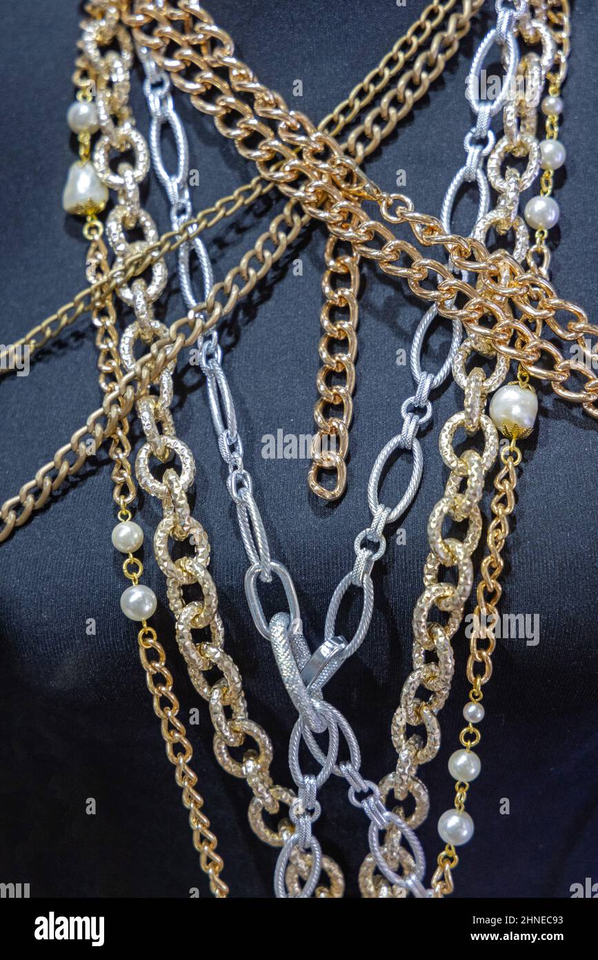 Many Golden Chains Necklaces at Black Background Stock Photo - Alamy