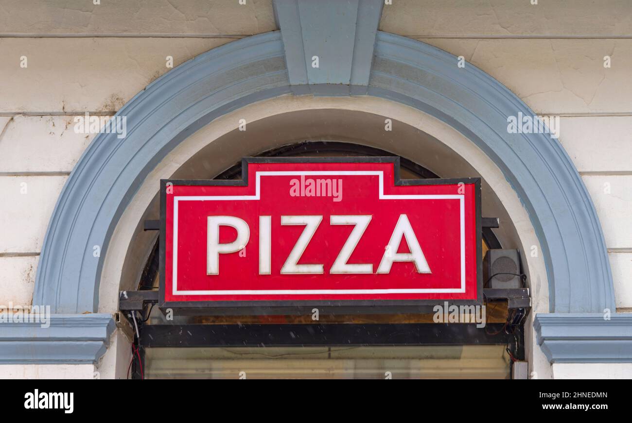 Big Red Sign Pizza at Door Arch Fast Food Stock Photo - Alamy