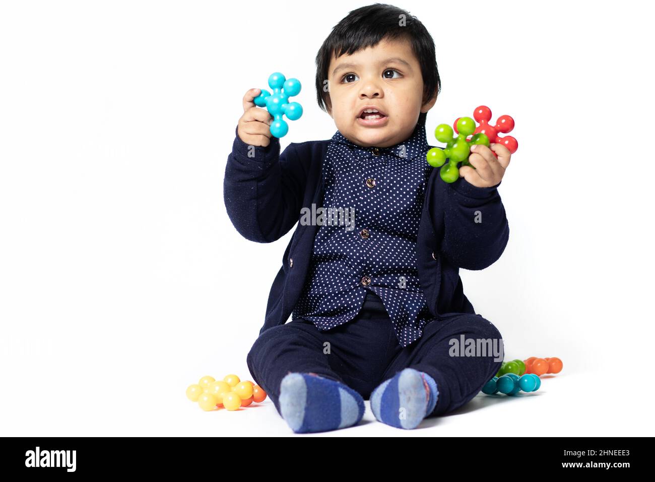 Happy Indian Toddler Playing With Colorful Toys Isolated On White ...