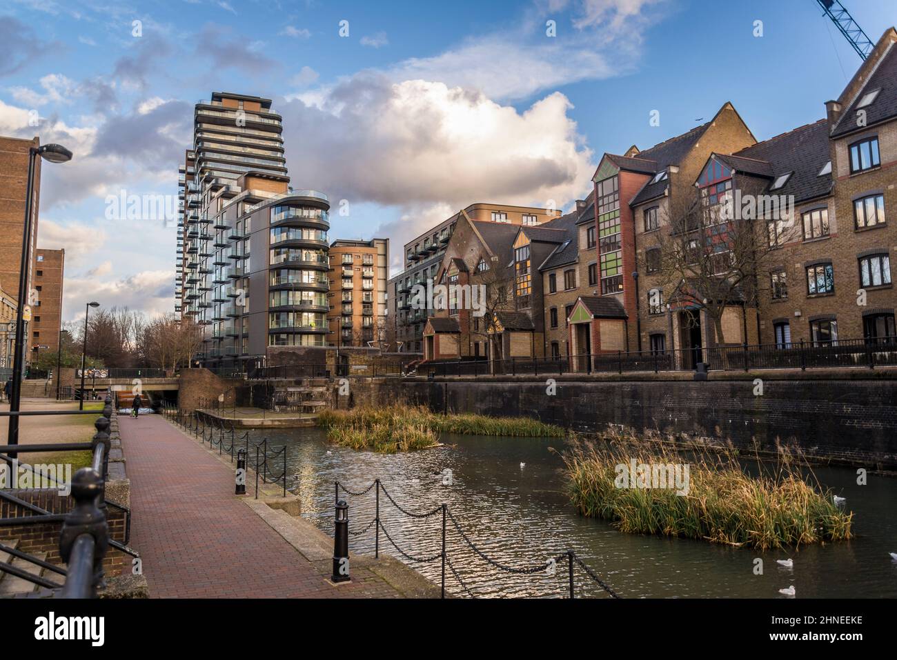 New housing development along a canal and Discovery Walk in Wapping, a ...