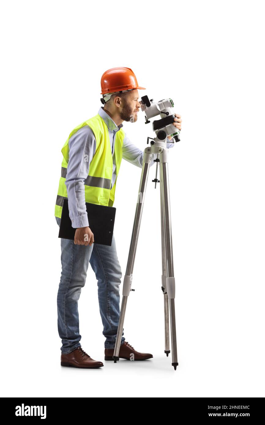 Full length profile shot of a geodetic surveyor working with a ...