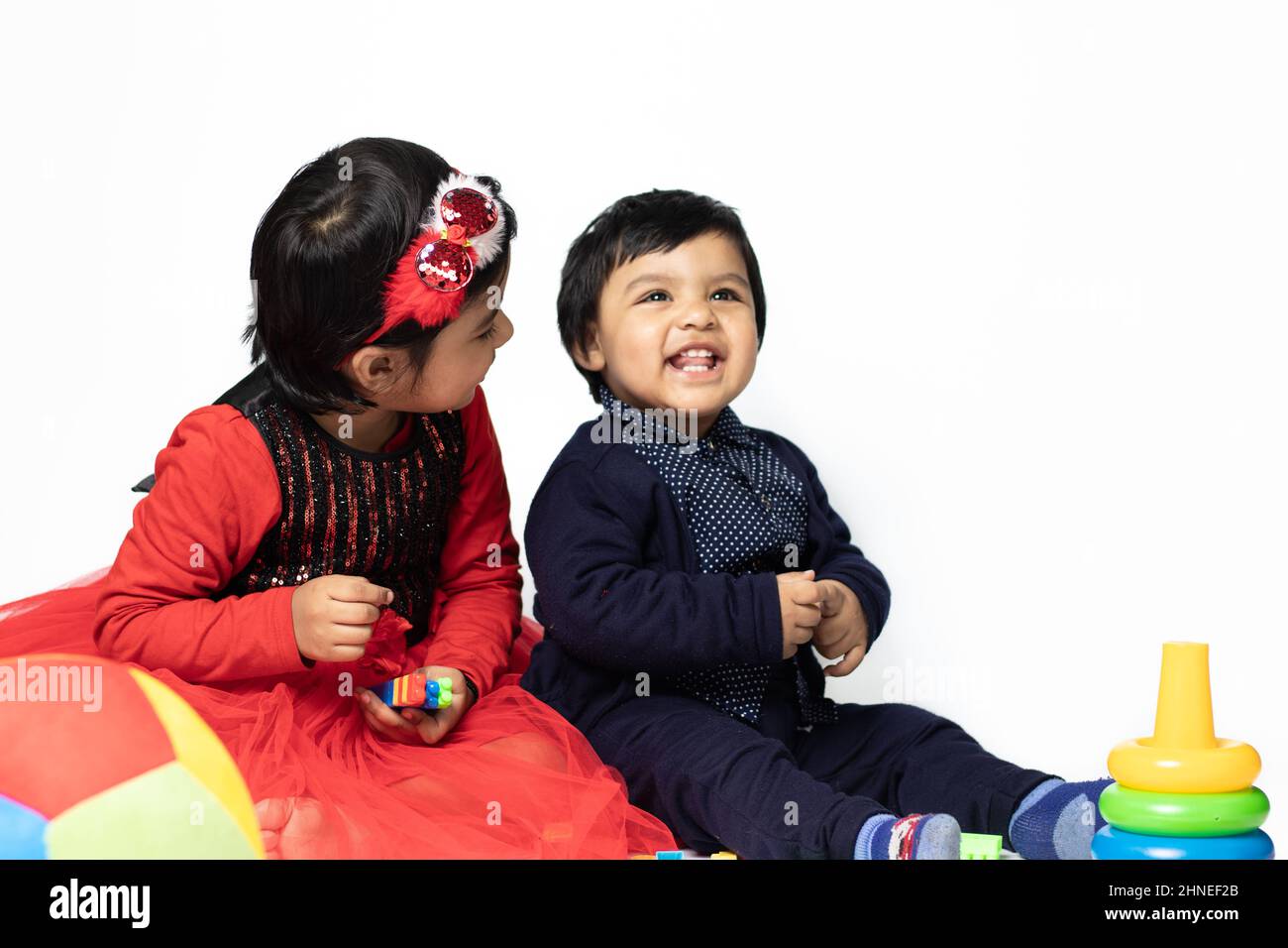 Happy Asian Indian Kids Girl And Boy Enjoying And Playing With Colorful ...