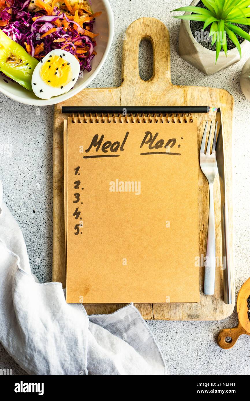 Overhead view of a bowl of red cabbage, carrot, green pepper and boiled ...