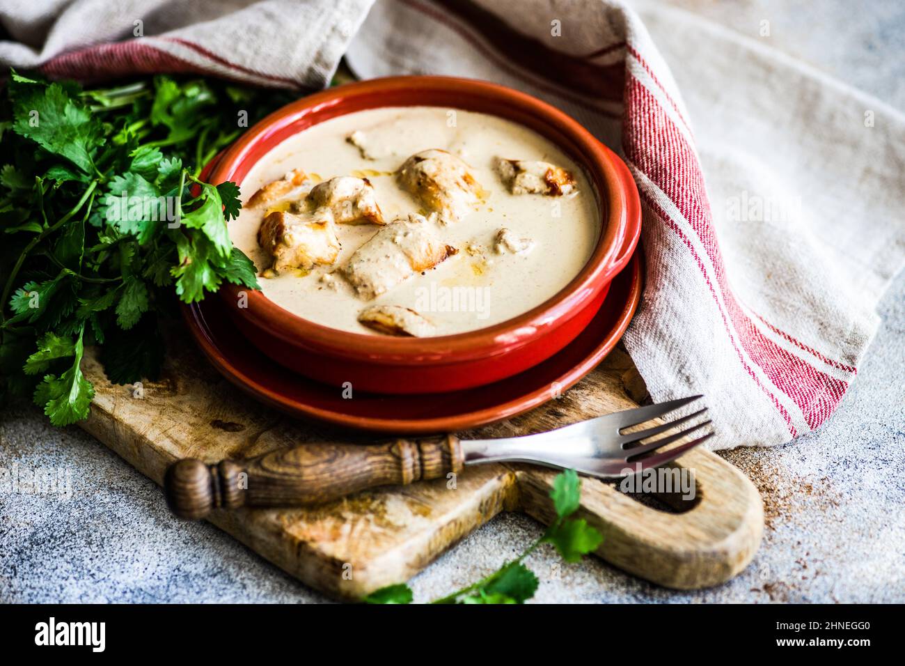 Overhead view of a bowl of Georgian chicken in walnut sauce (Chicken ...