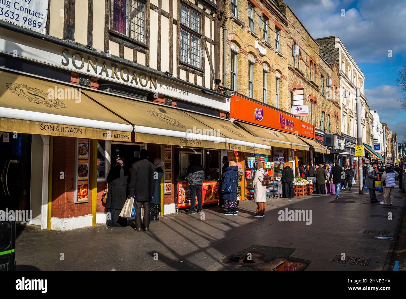 People walking on Whitechapel Road, Tower Hamlets, London, UK Stock ...
