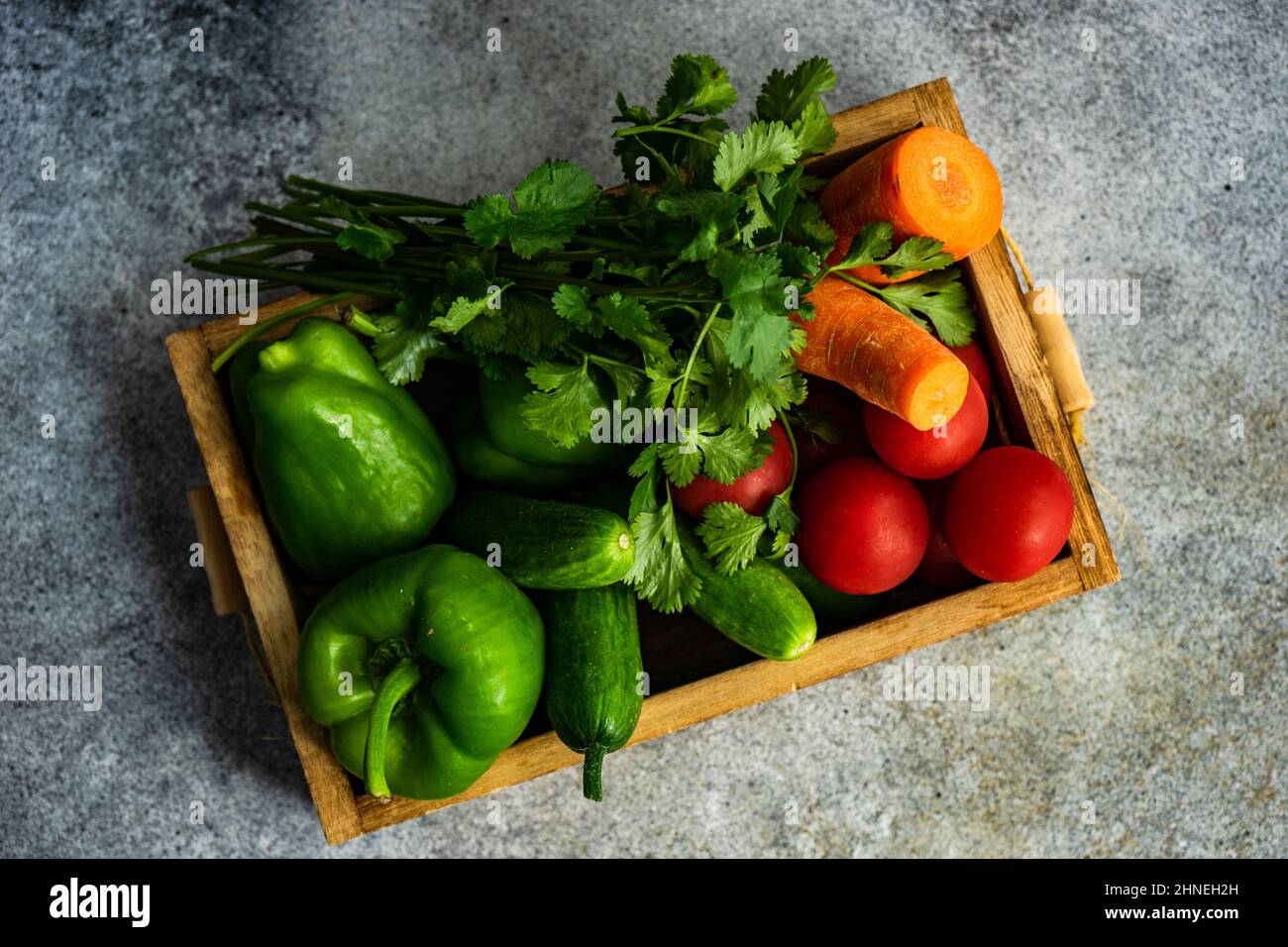 Overhead view of a box of fresh vegetables and coriander Stock Photo - Alamy