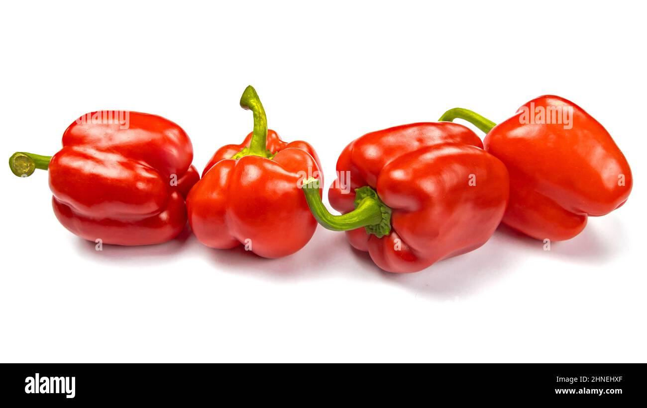 red pepper group isolated on tiles Stock Photo - Alamy