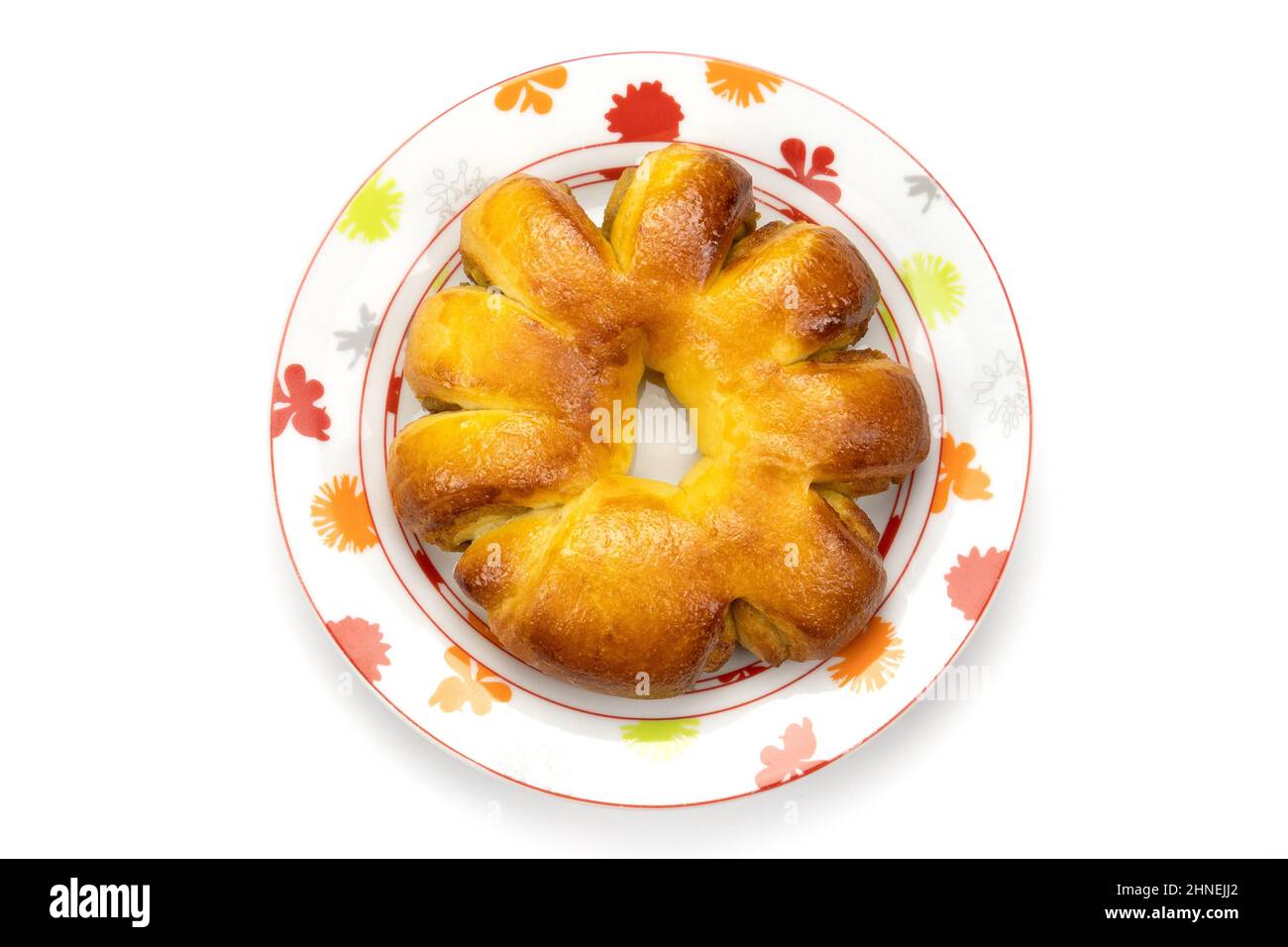 bun in a plate on a white background Stock Photo - Alamy