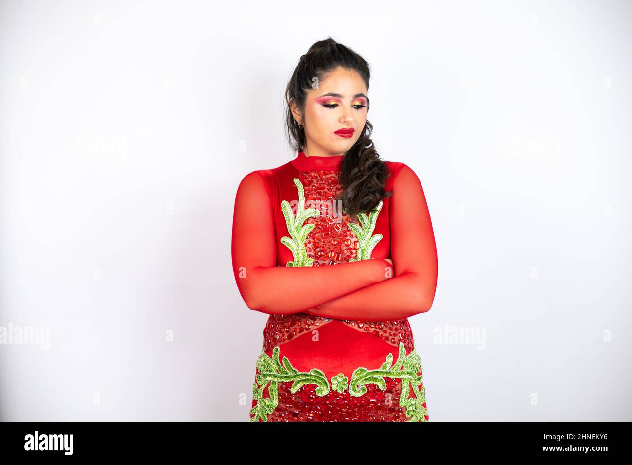 Young beautiful woman wearing carnival costume over isolated white ...