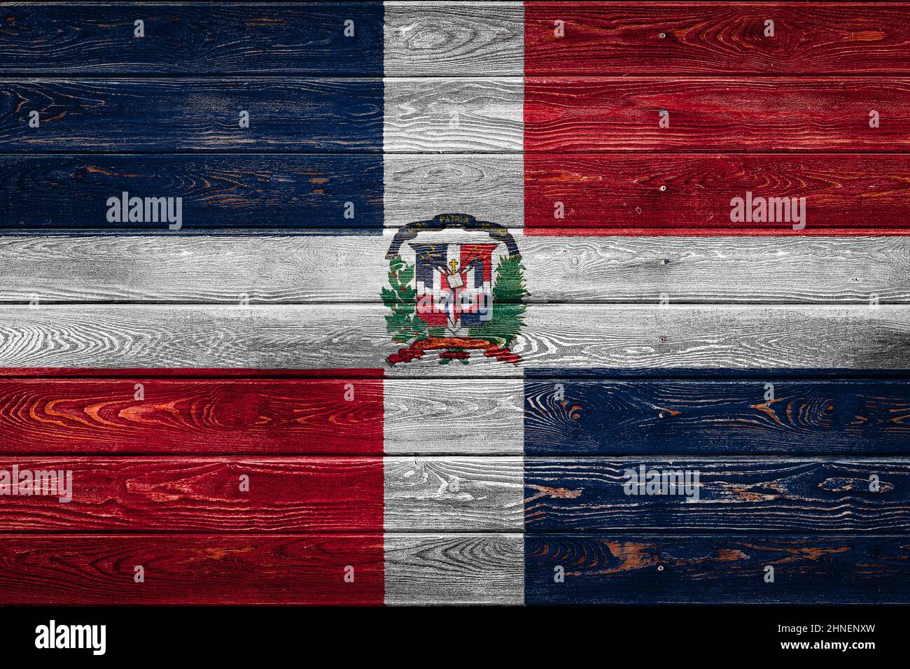 The national flag of Dominicana is painted on a camp of even boards ...