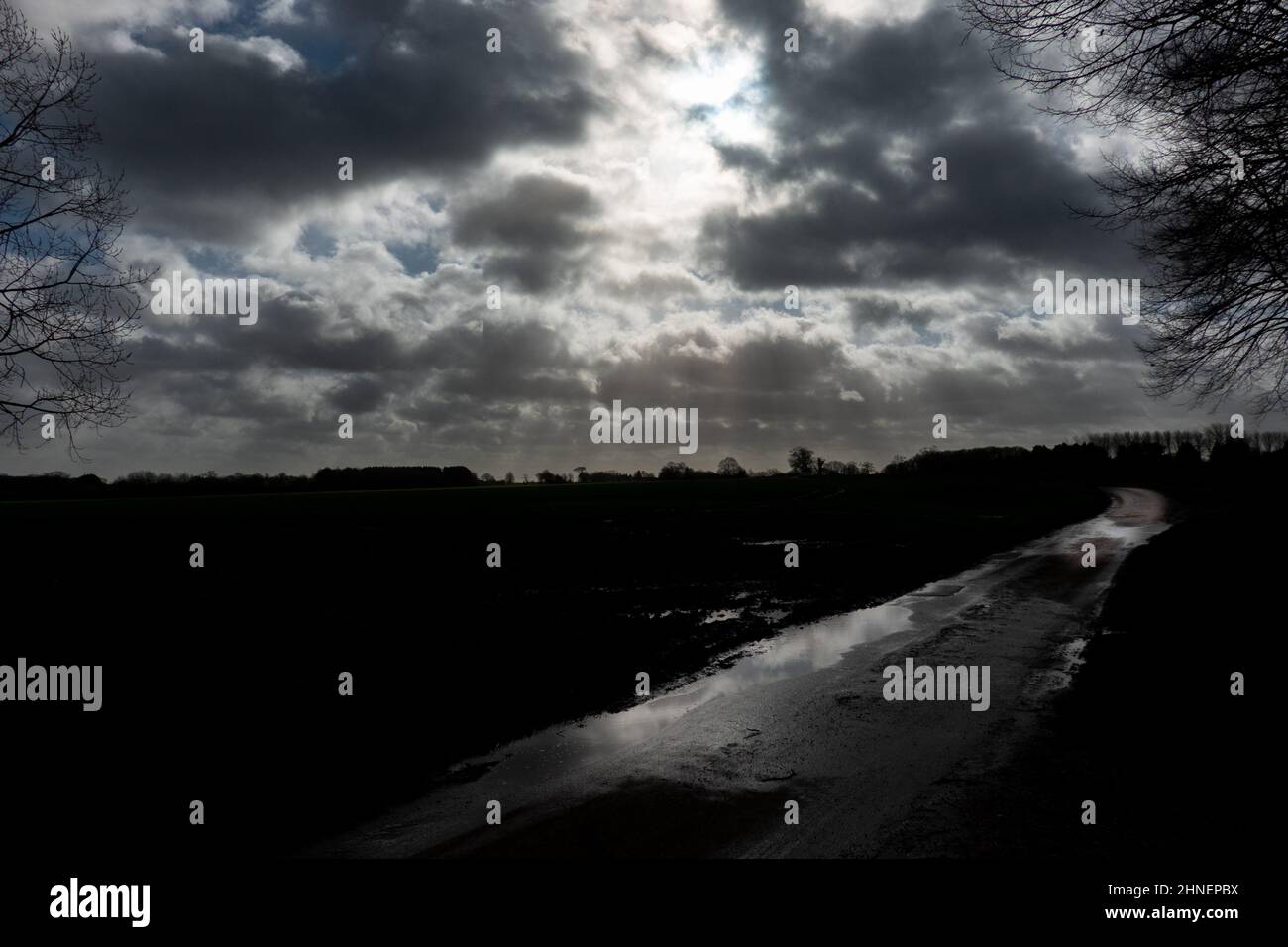Country lane, Dark rain clouds Stock Photo - Alamy