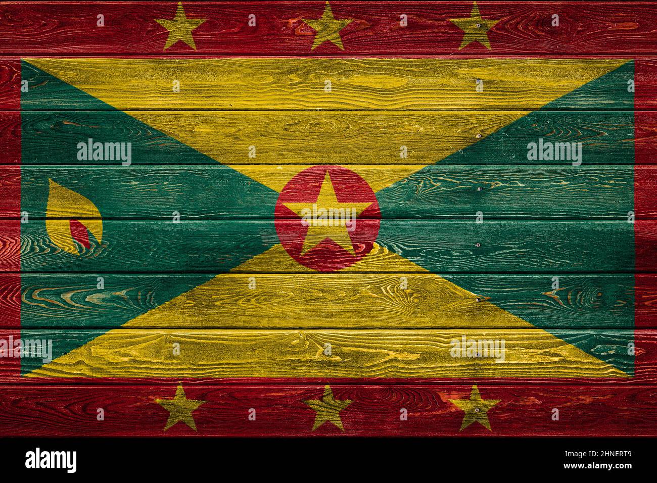 The national flag of Grenada is painted on a camp of even boards nailed ...