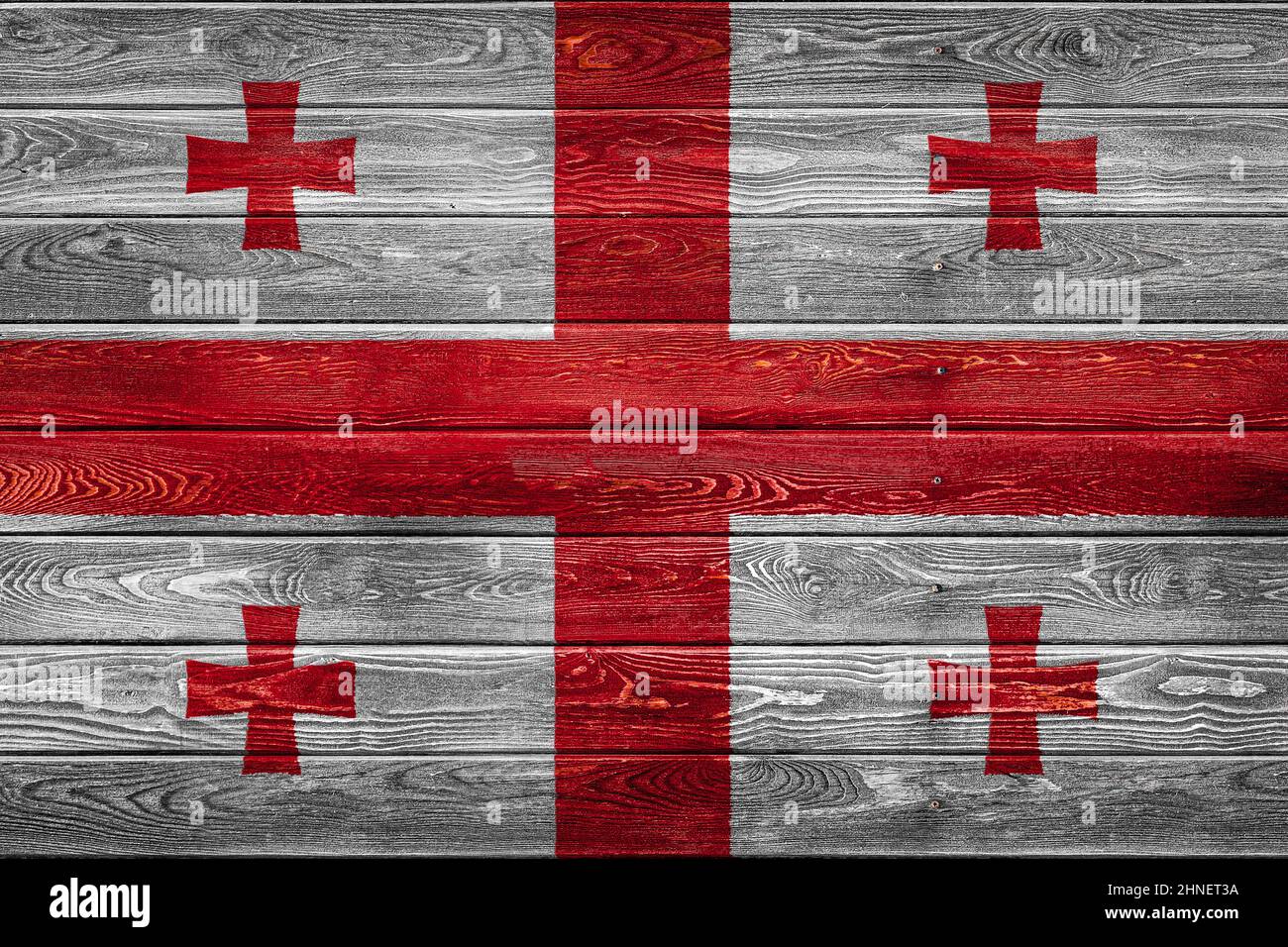 The national flag of Georgia is painted on a camp of even boards nailed ...