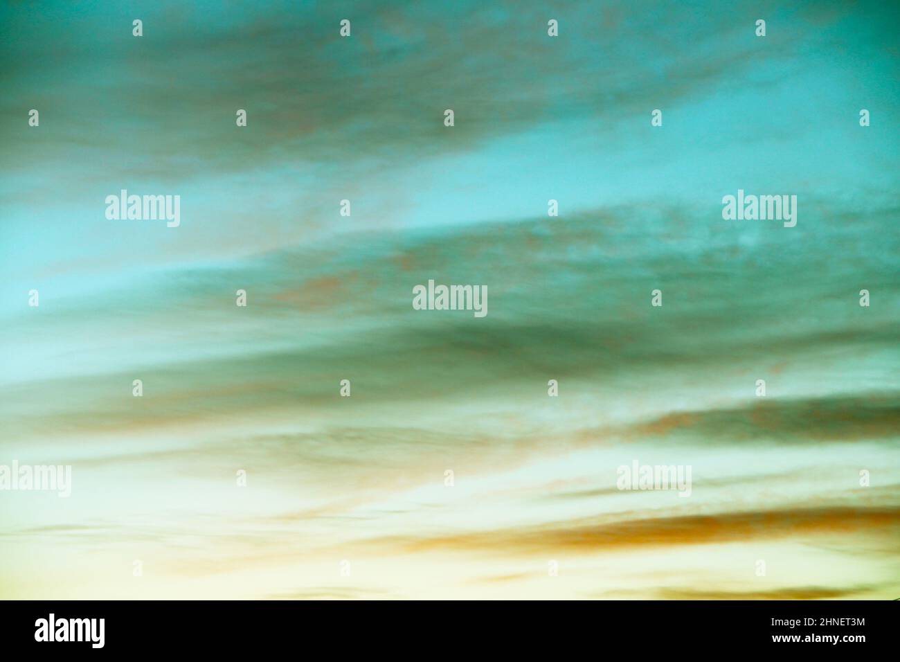 Clouds in the sky are illuminated from below by the light of the sun ...