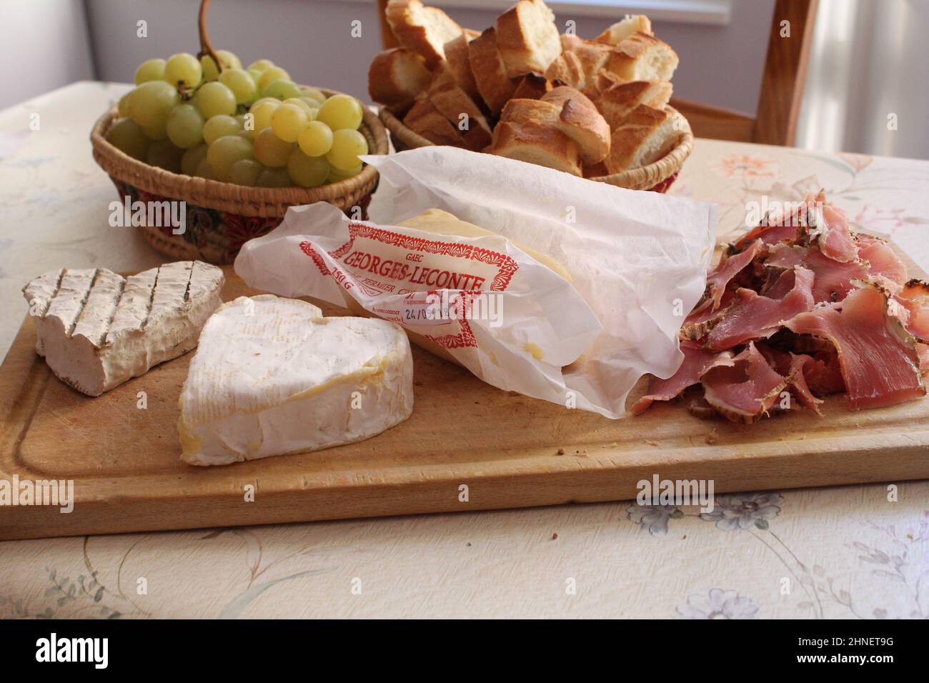 a delicious french tapas plank with neufchatel cheese, butter, dried ...