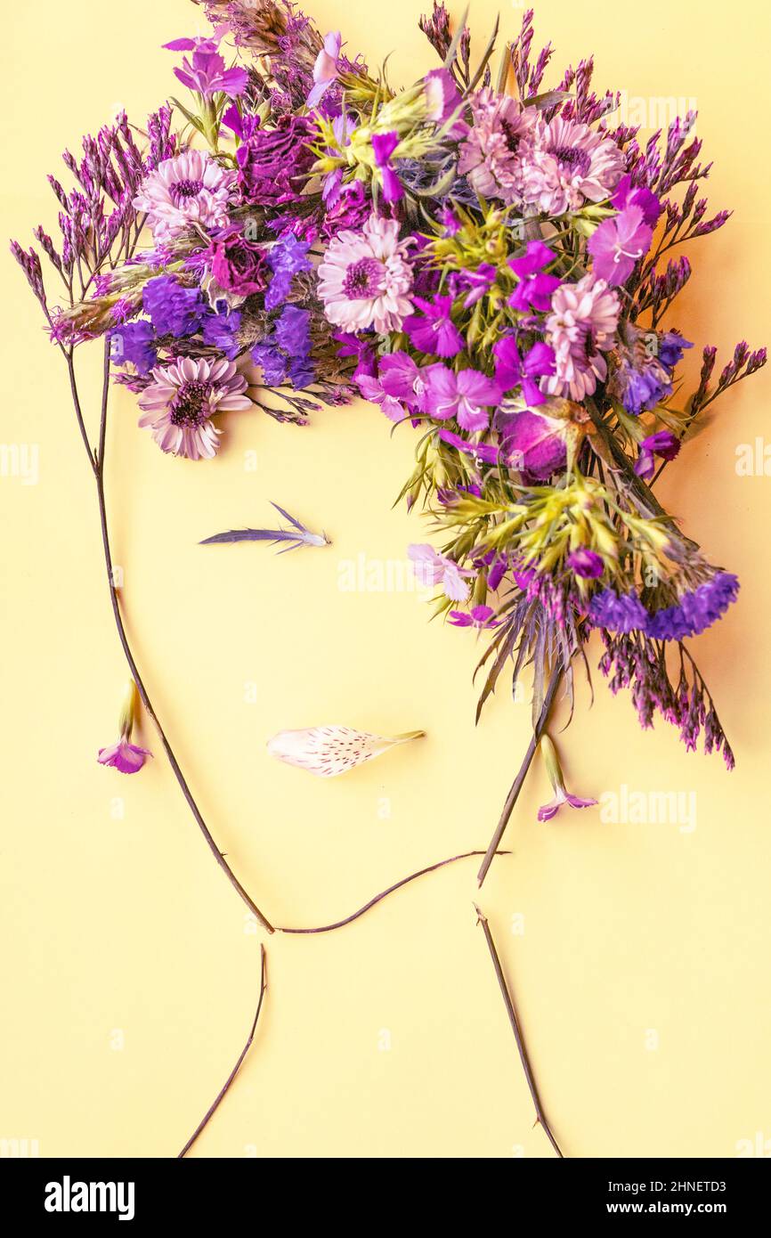 Beautiful decoration art of a girl face made by flowers on the wall ...