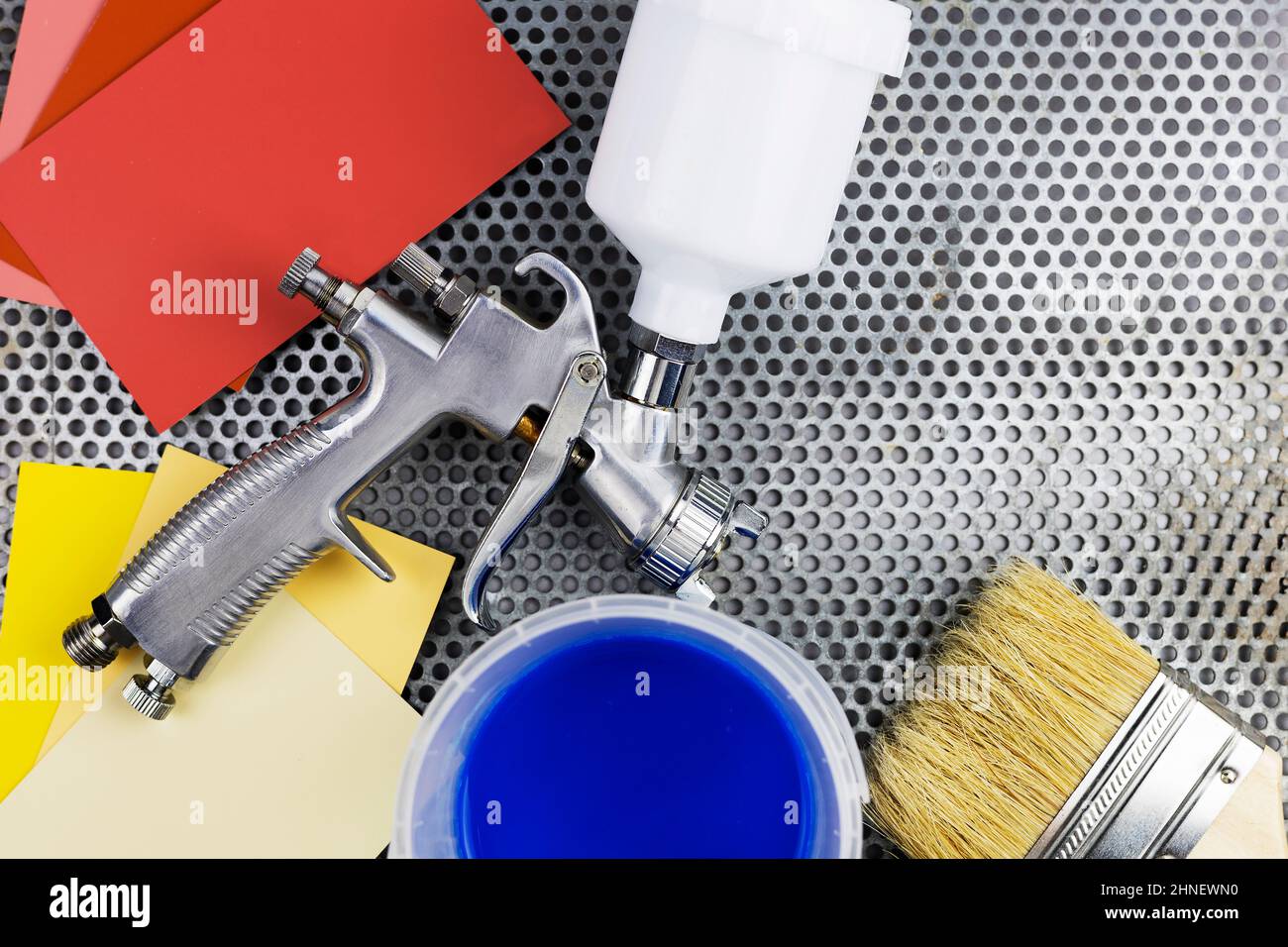 Paint spray gun at work at the workplace in the workshop. Paint Brush ...