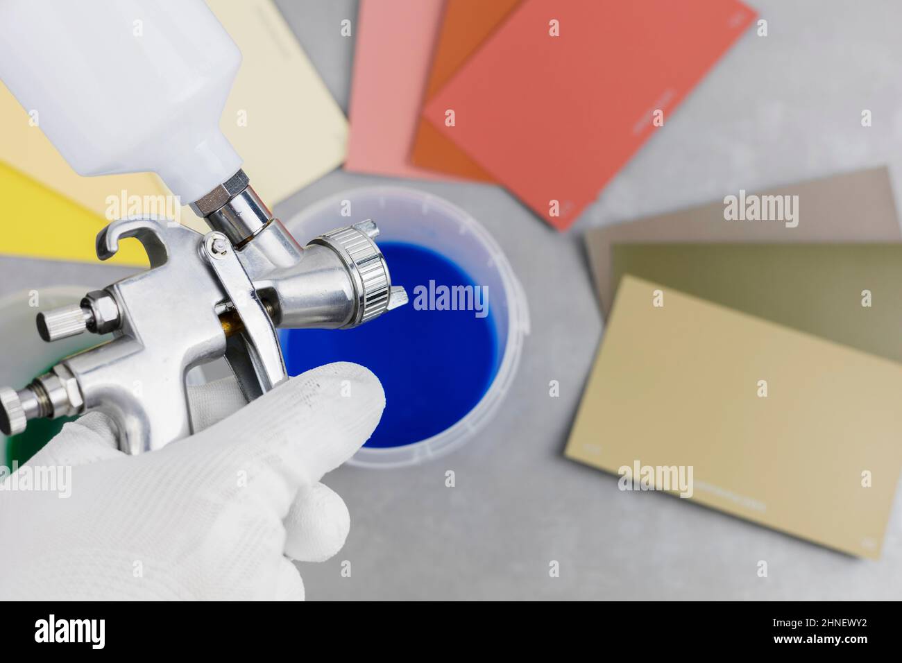 paint spray gun at work at the workplace in the workshop Stock Photo ...