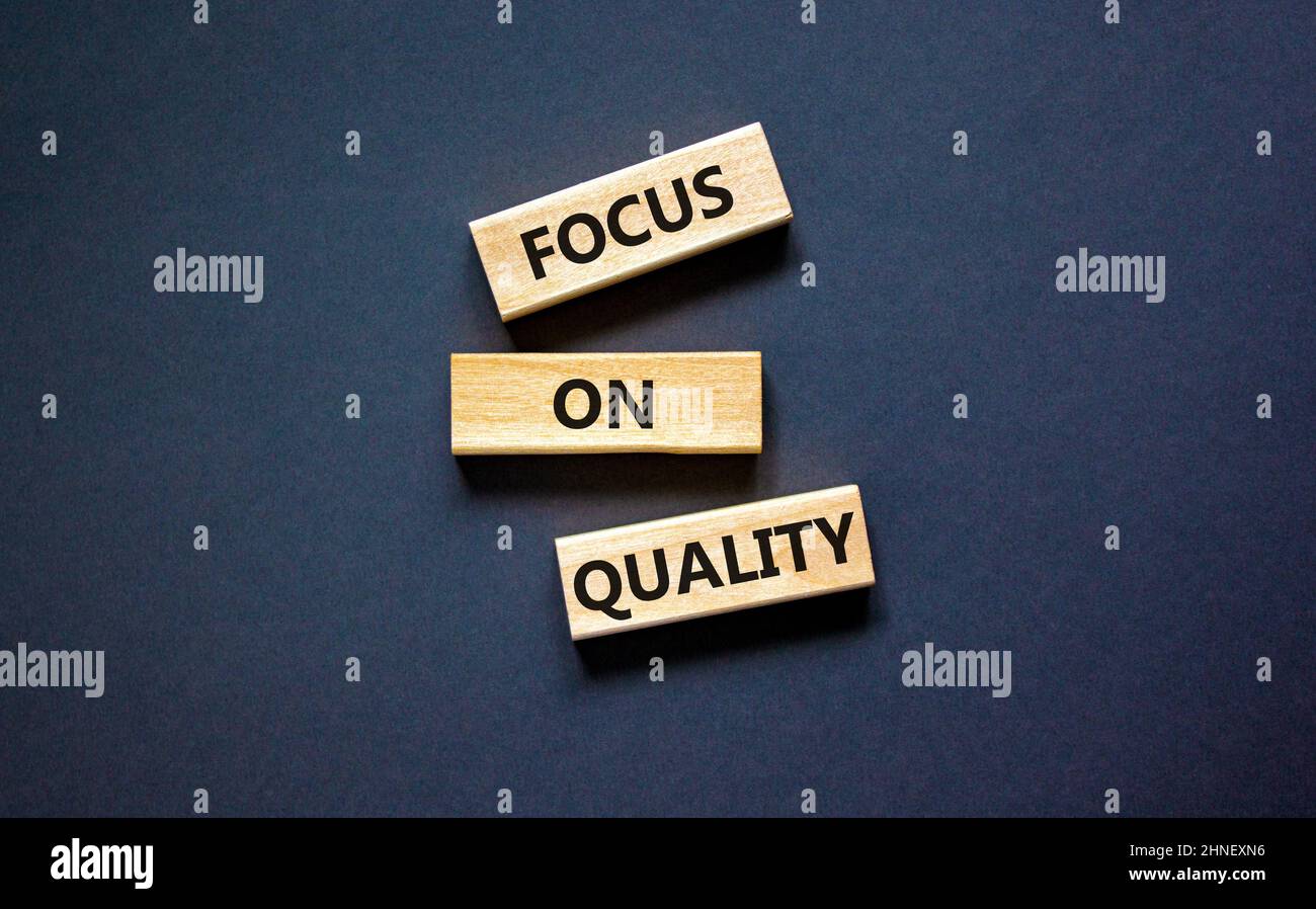 Focus on quality symbol. Concept words Focus on quality on blocks on ...