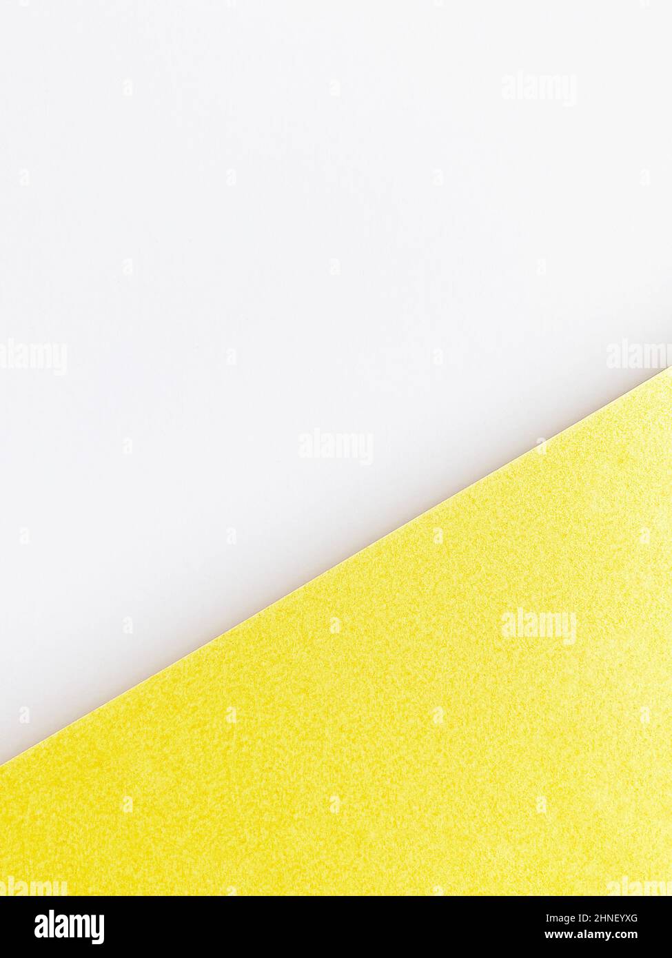 yellow cardboard against white paper sheet Stock Photo - Alamy