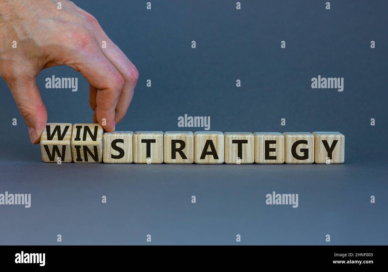 Win-win strategy symbol. Businessman turns wooden cubes with words win ...