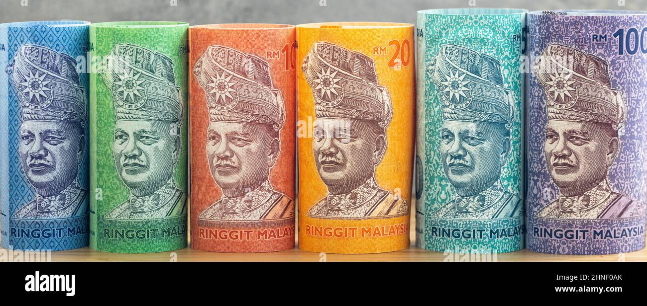 Malaysian currency, Money rolls, Ringgit banknotes lined up in a row ...