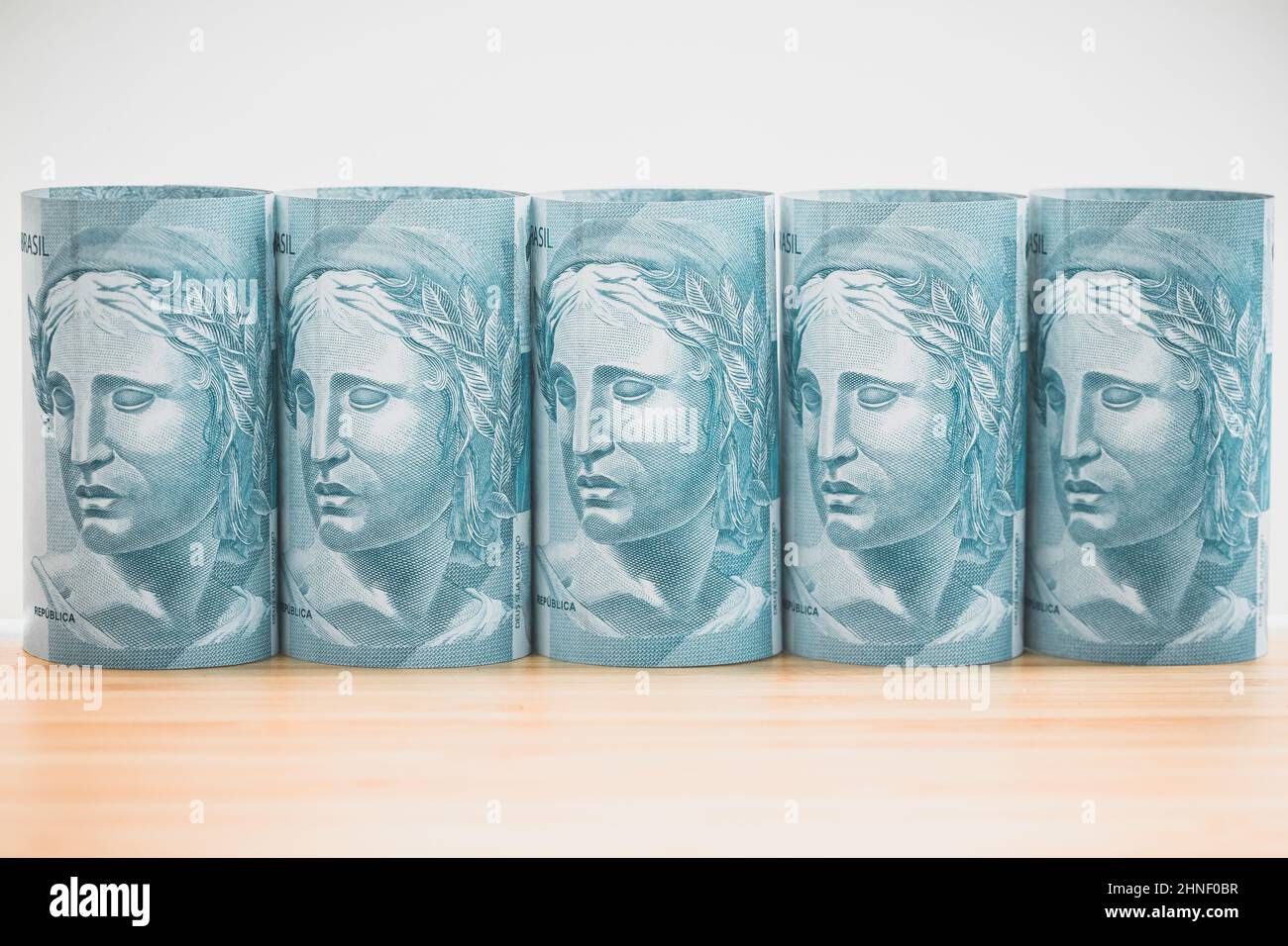 Brazilian currency, Rolls of money, 100 Reais banknotes arranged in a ...
