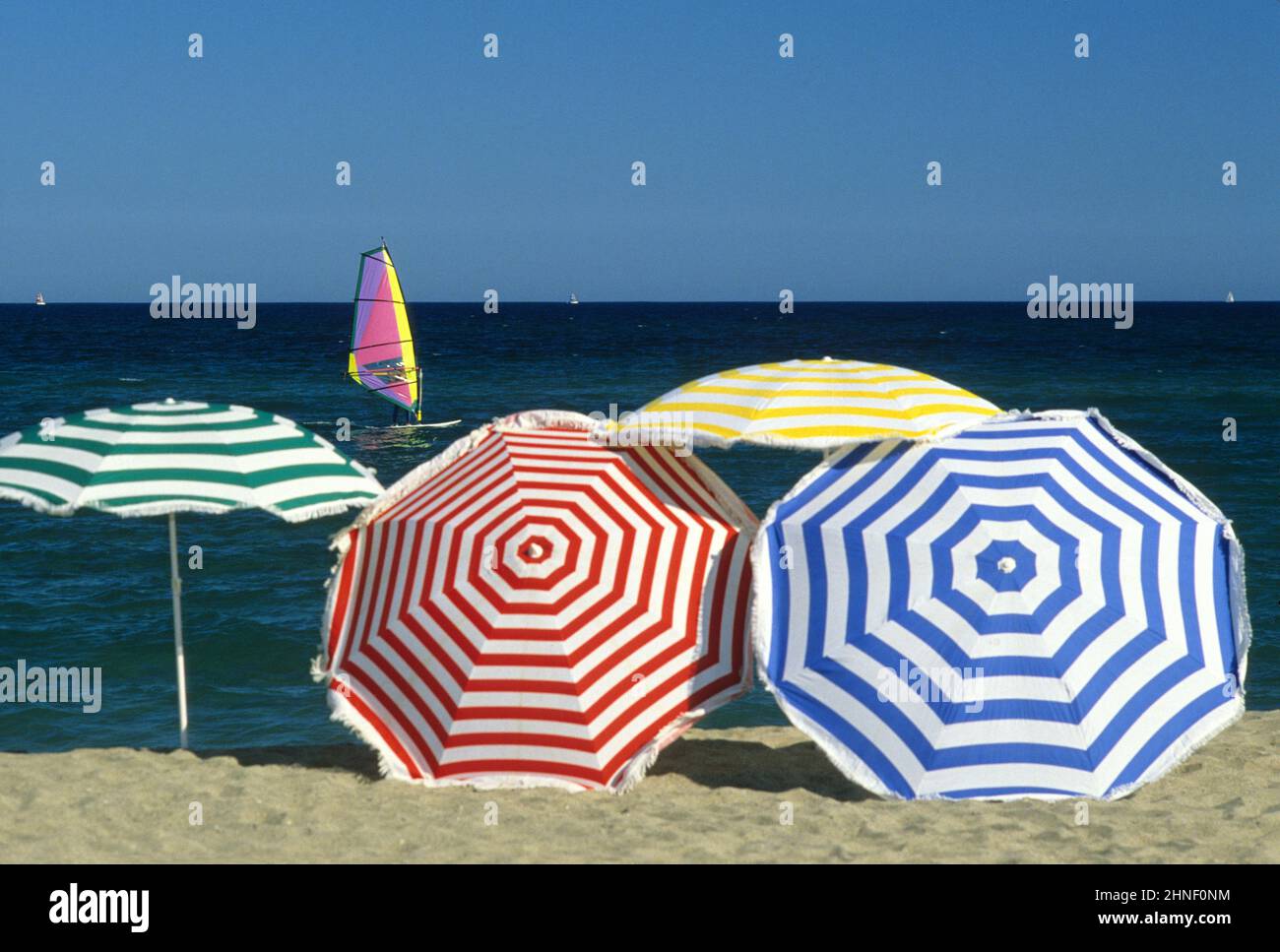 beach graphism effect multi colored umbrellas blue sky and sewater ...
