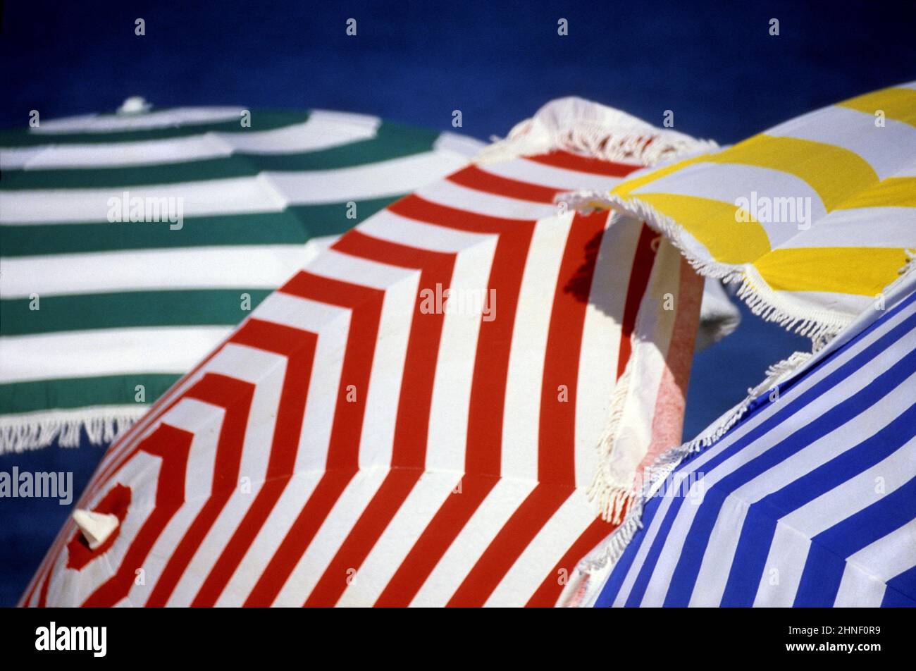 beach graphism effect umbrellas multi colored Stock Photo - Alamy
