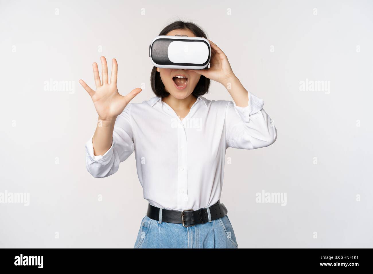 Vr chat. Asian girl saying hello in virtual reality glasses, smiling ...