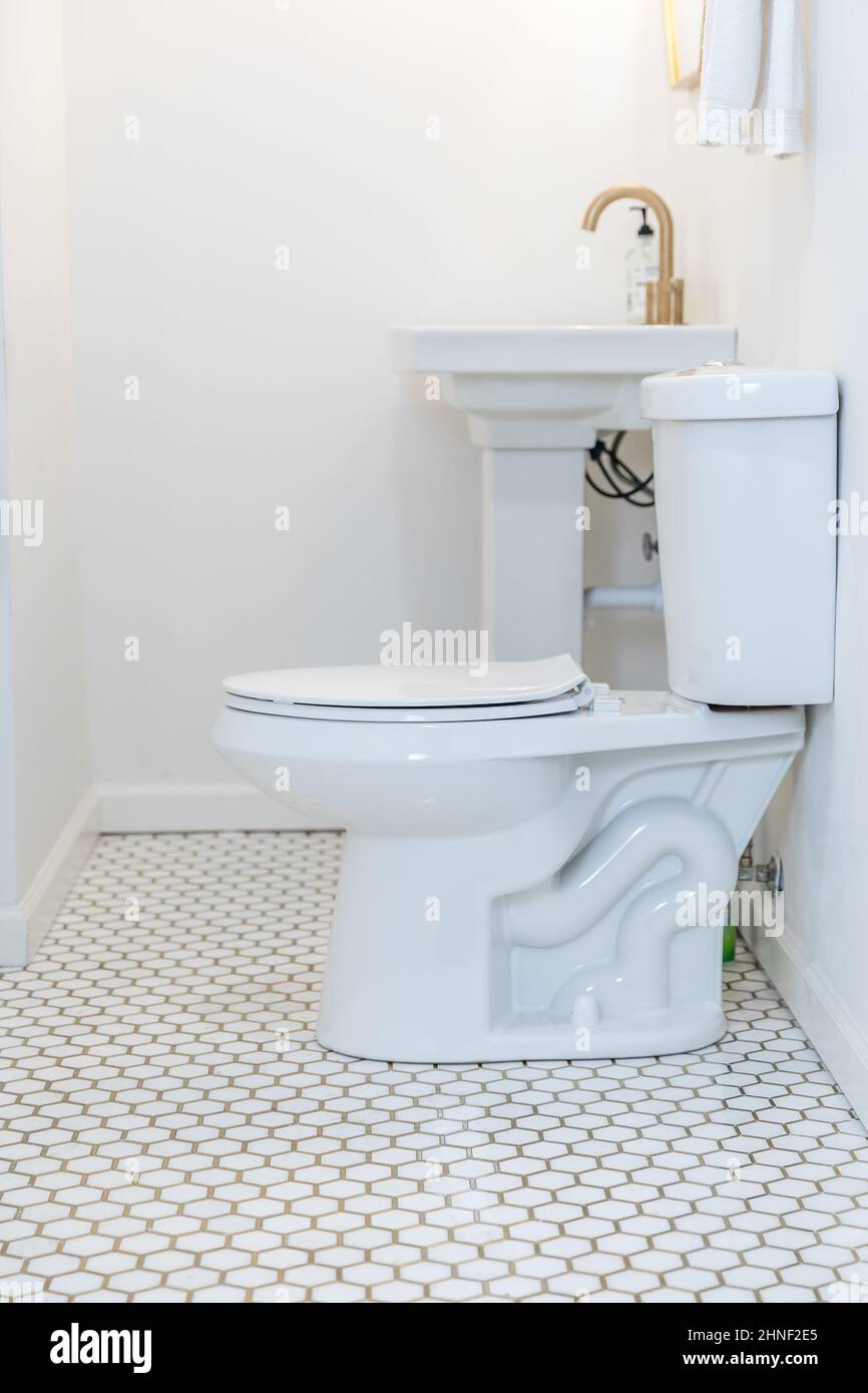 A small toilet and sink area Stock Photo - Alamy