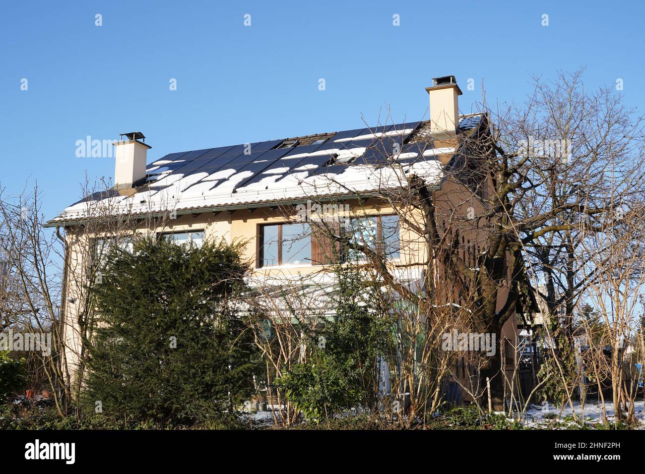 Photovoltaic panels or solar panels installed on the roof of a family ...