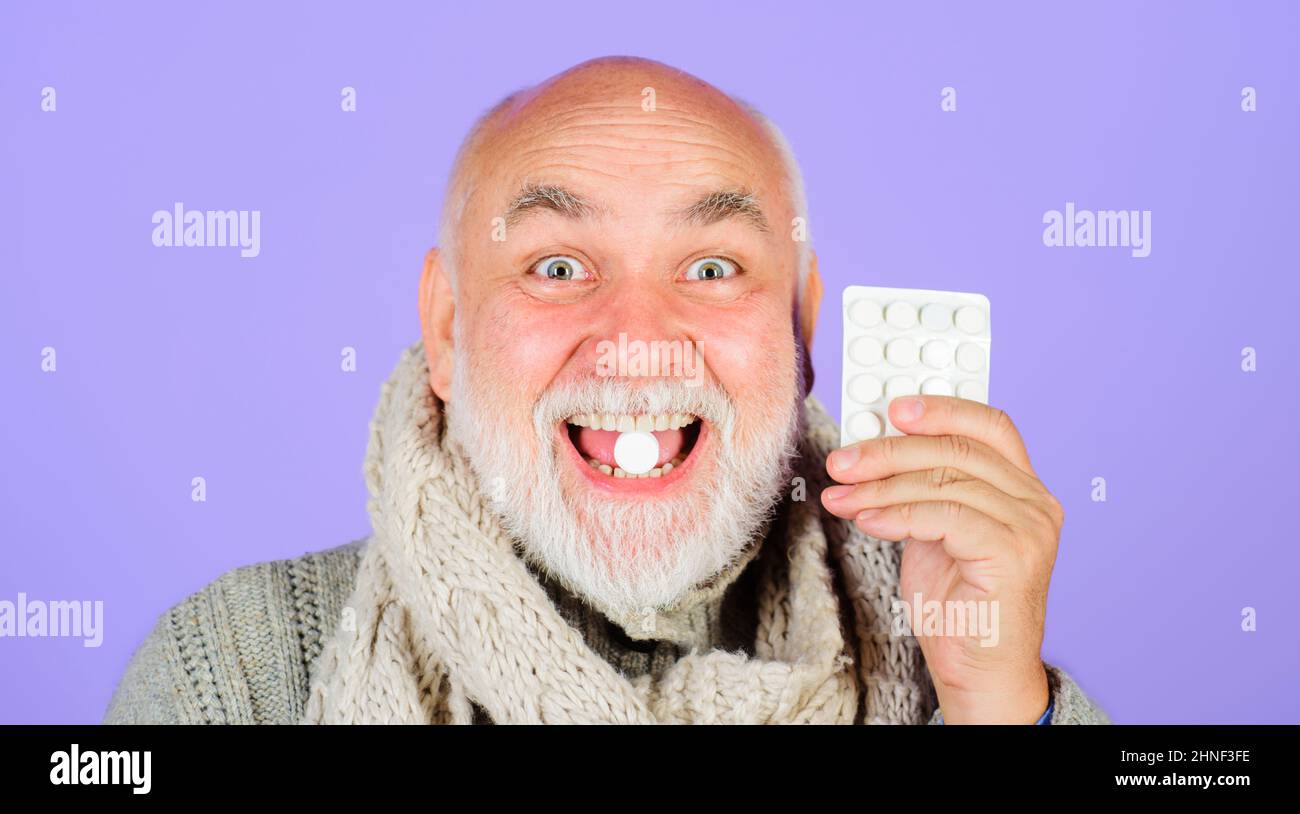 Sick man with blister pack with tablets taking pills. Pharmaceutical ...