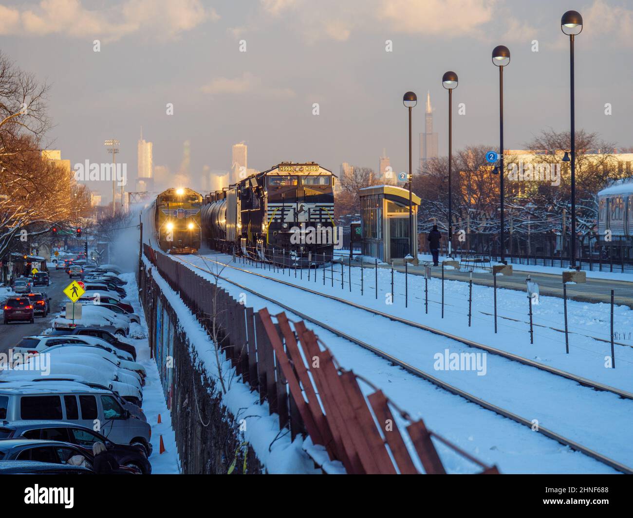 Union Pacific freight train passes parked Norfolk Southern freight as a ...