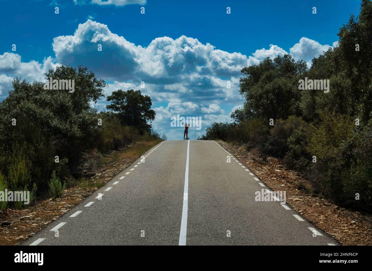 Woman alone on beautiful empty country bend, asphalt road Stock Photo ...
