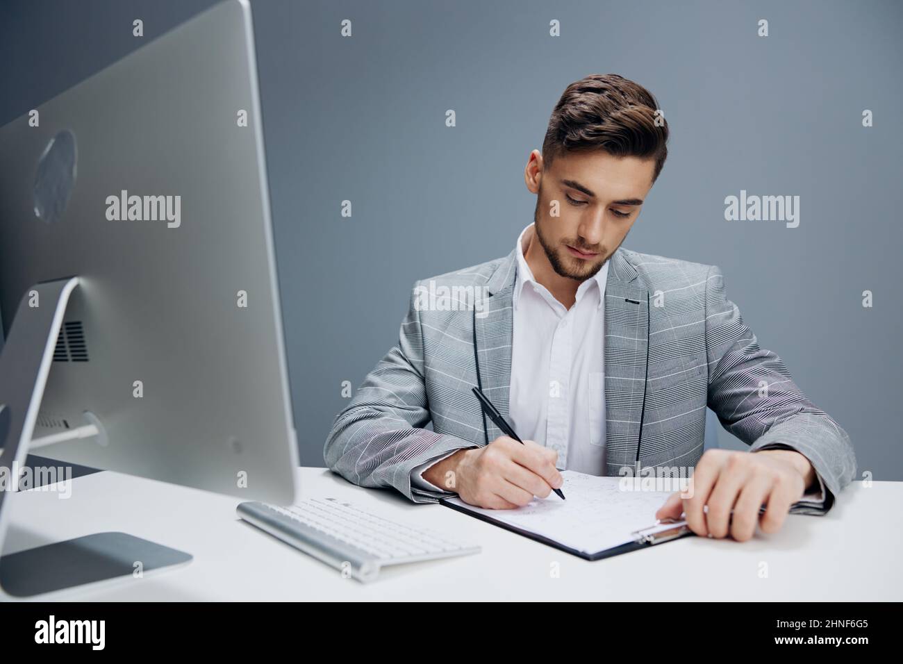 manager working at the computer in the office isolated background Stock ...