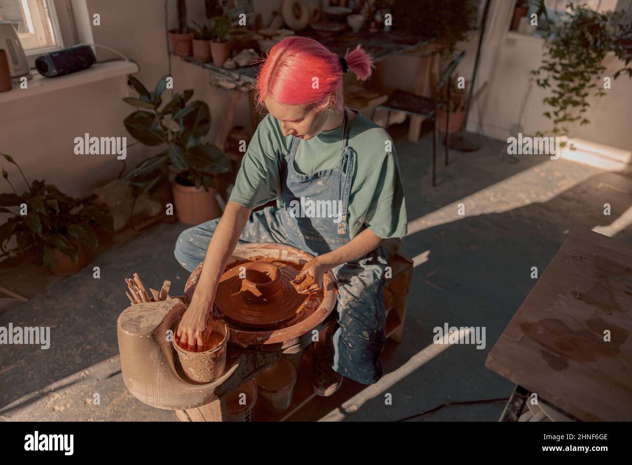 Young skillful pottery master hi-res stock photography and images - Alamy