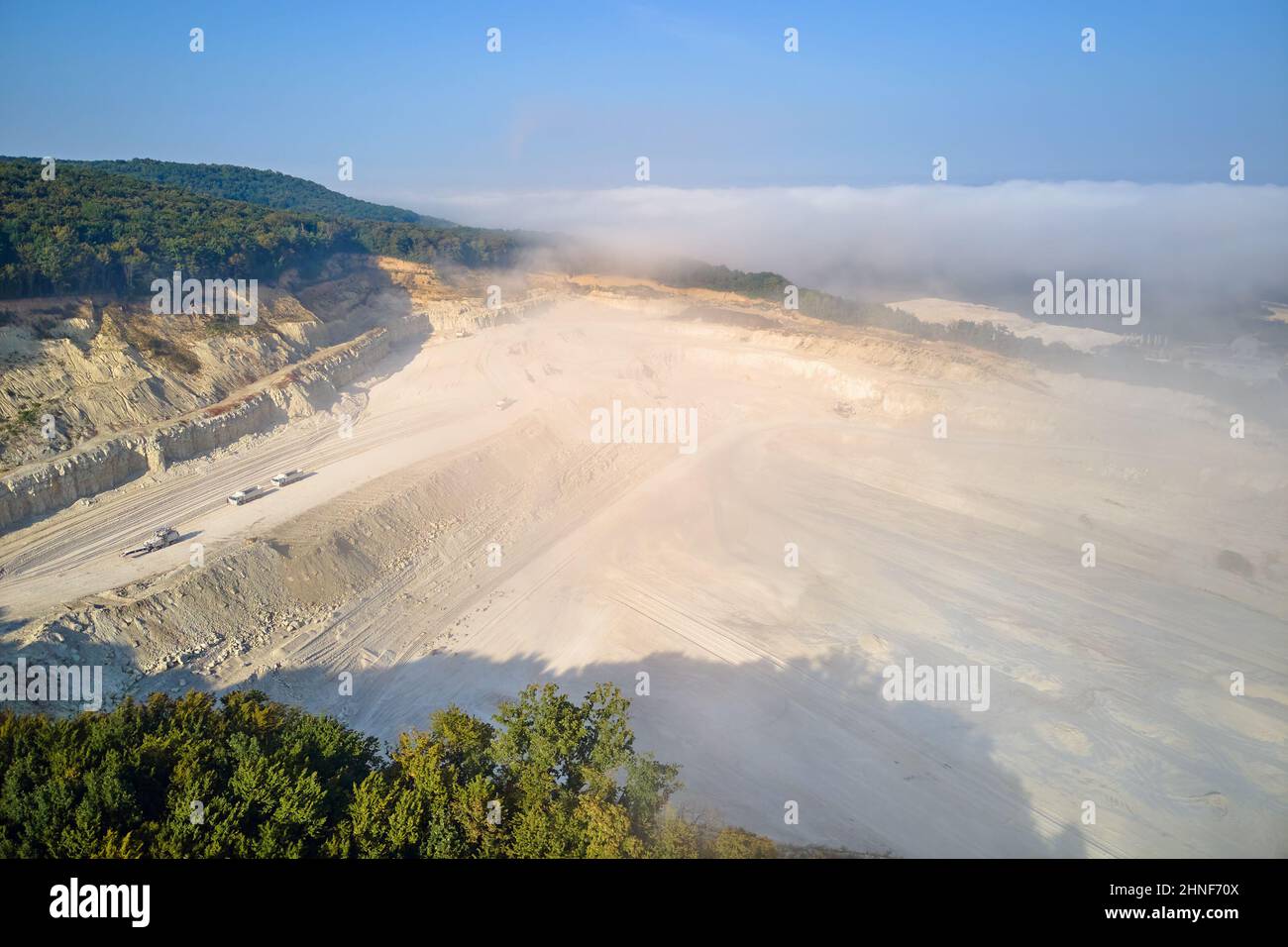 Aerial view of open pit mining of limestone materials for construction ...