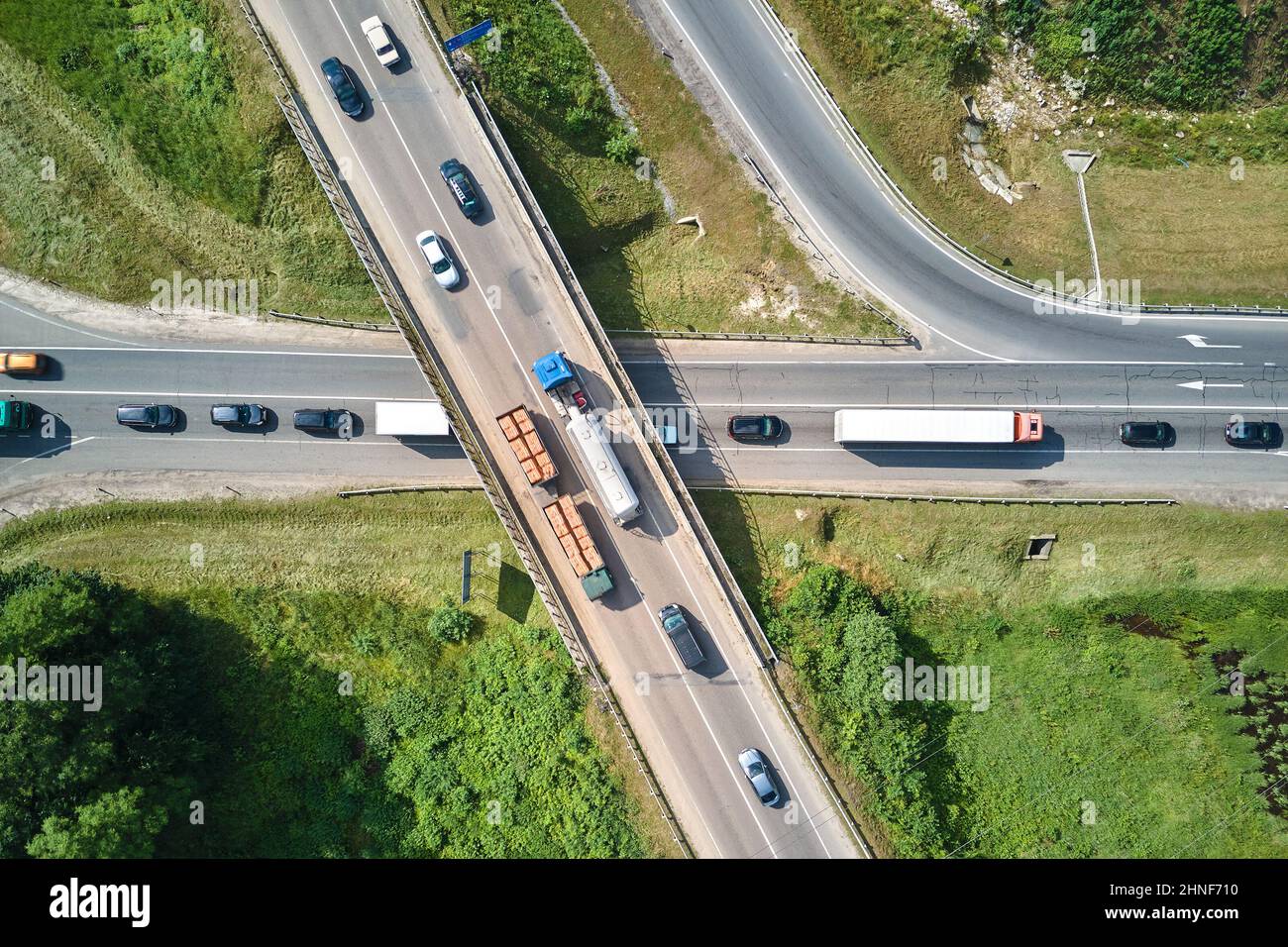 Aerial view of road intersection with fast moving heavy traffic on city ...
