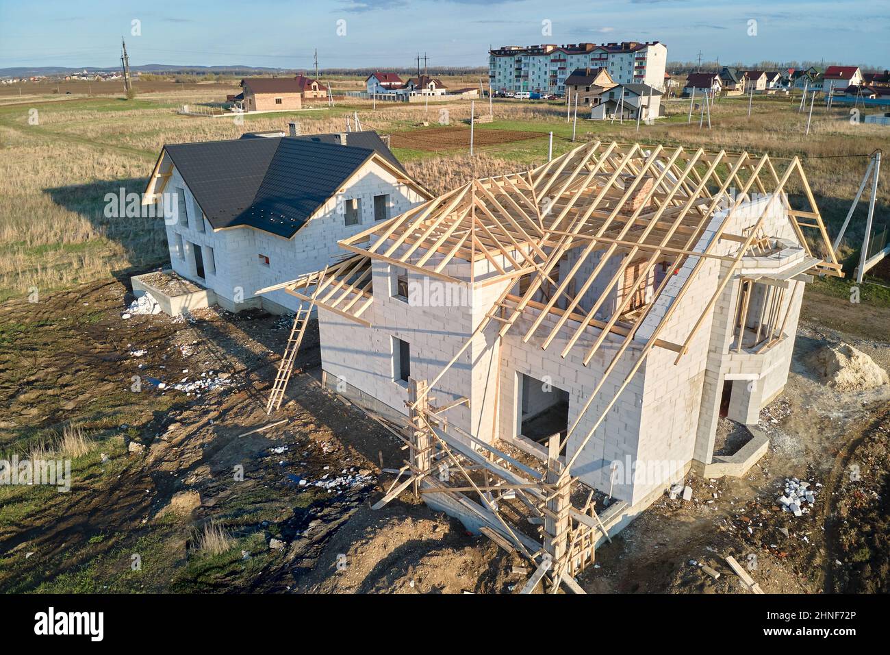 Aerial view of unfinished frame of private house with aerated ...