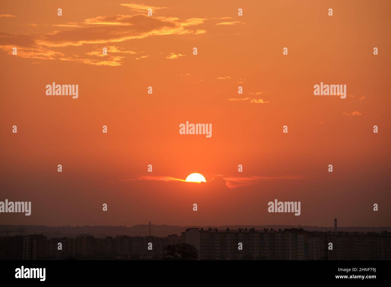 Bright colorful sunset sky with rays of setting sun and vivid dark ...